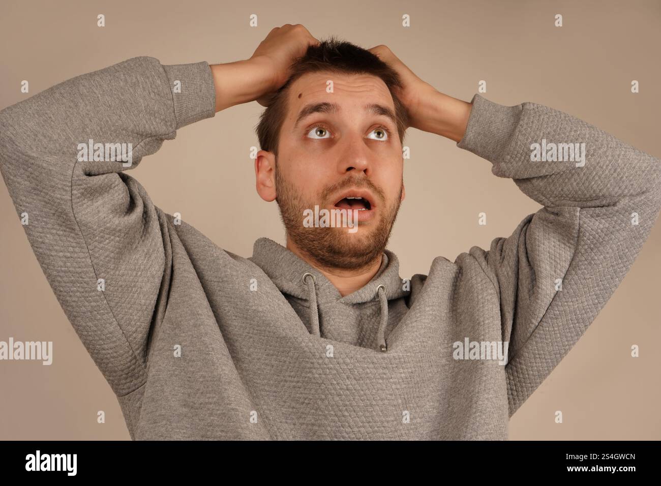 His face reflects a moment of suffering. The pose creates an ...