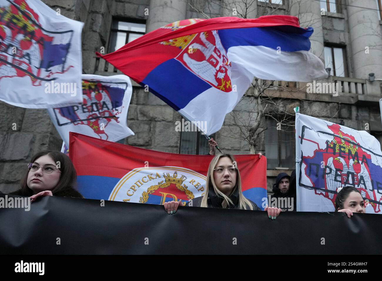 People gather in front of Serbia's Constitutional Court building during ...
