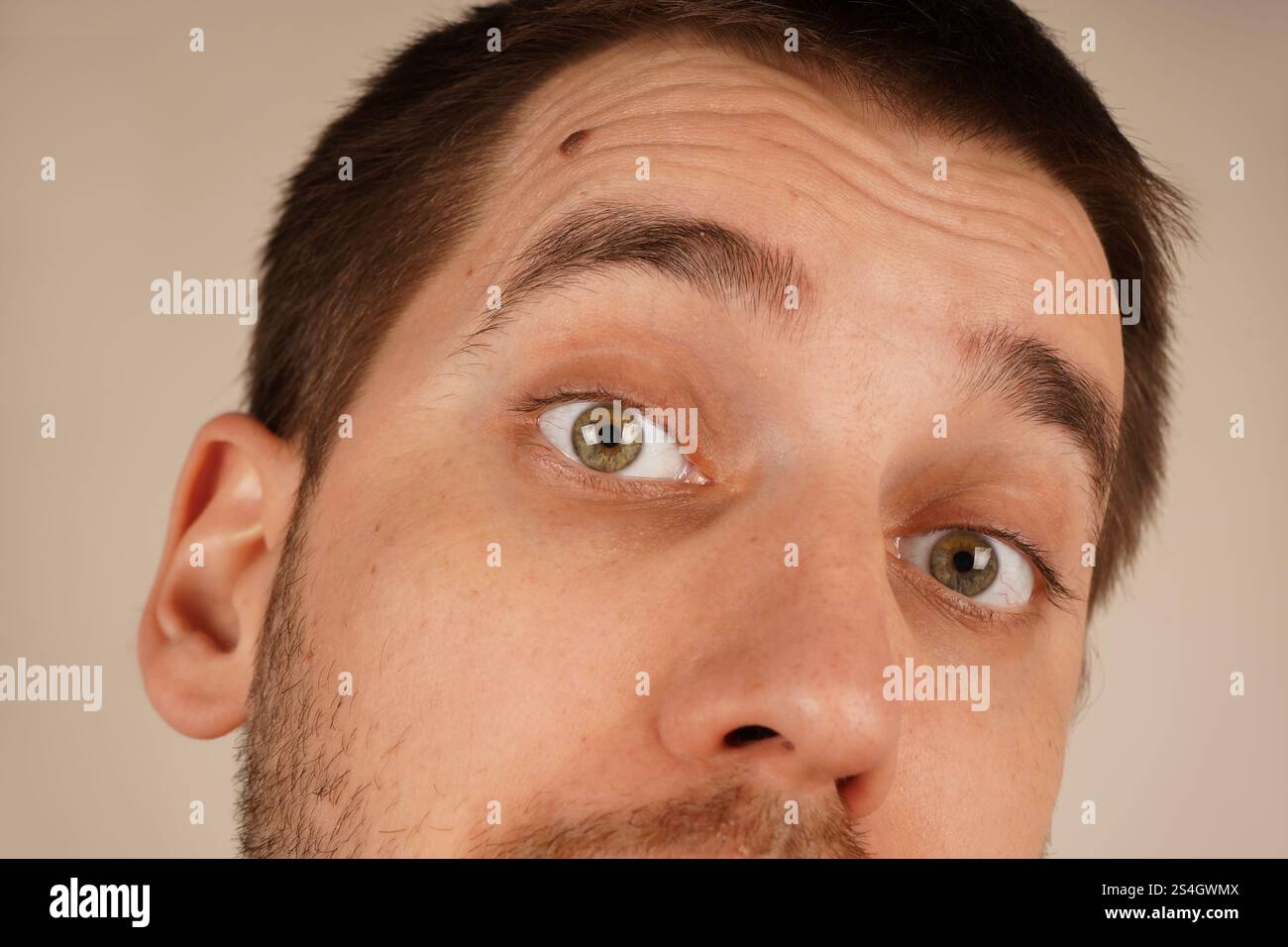 The furrows on his brow reflect his immediate reaction to something ...