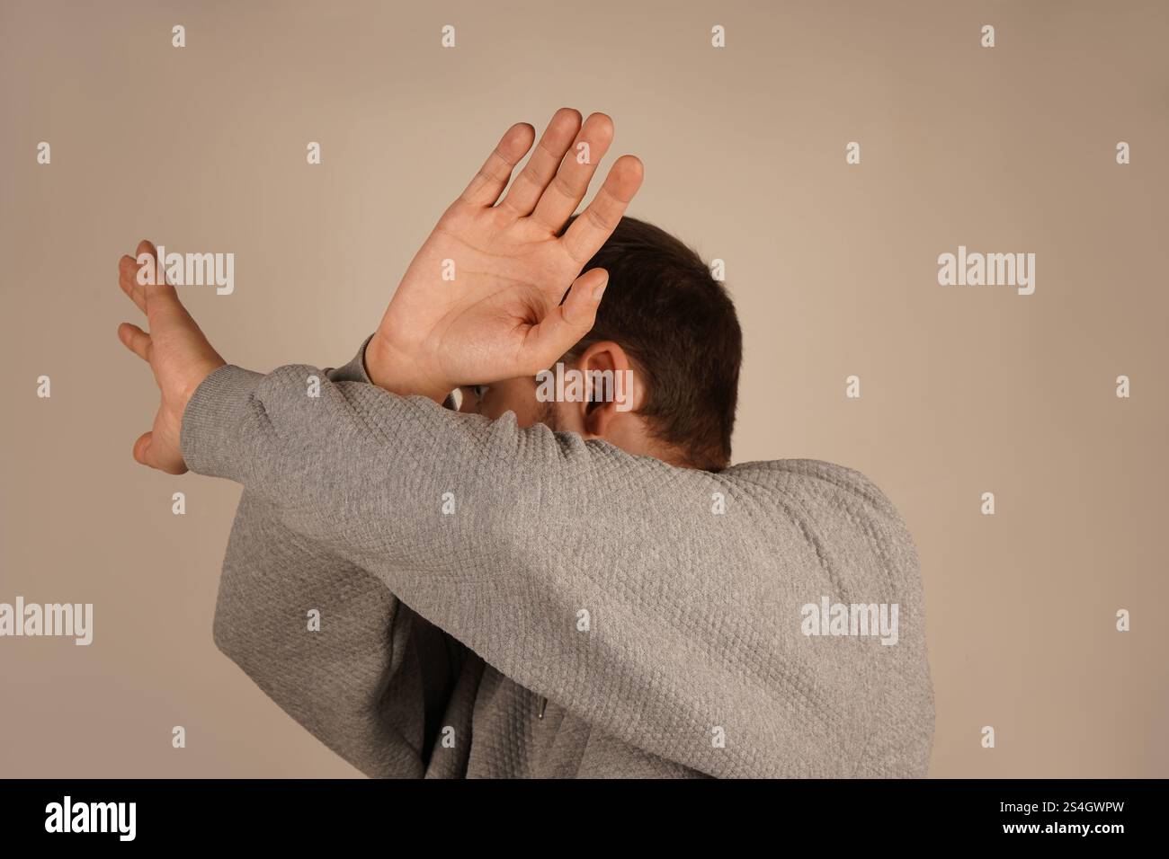 His open palms emphasize a defensive and assertive position. The image ...