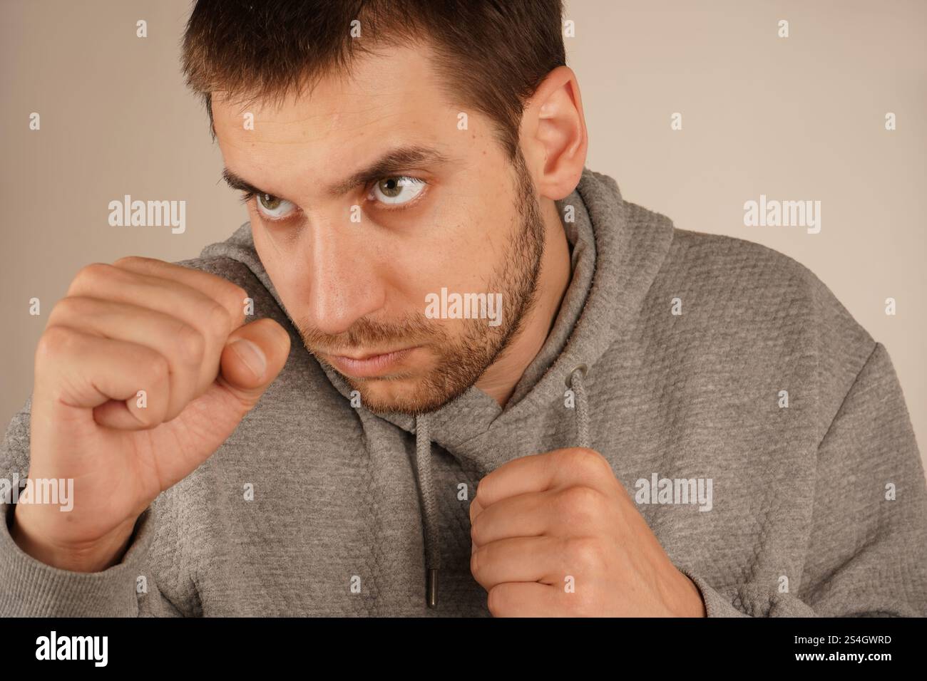 The scene suggests physical preparation and mental resilience. The man ...