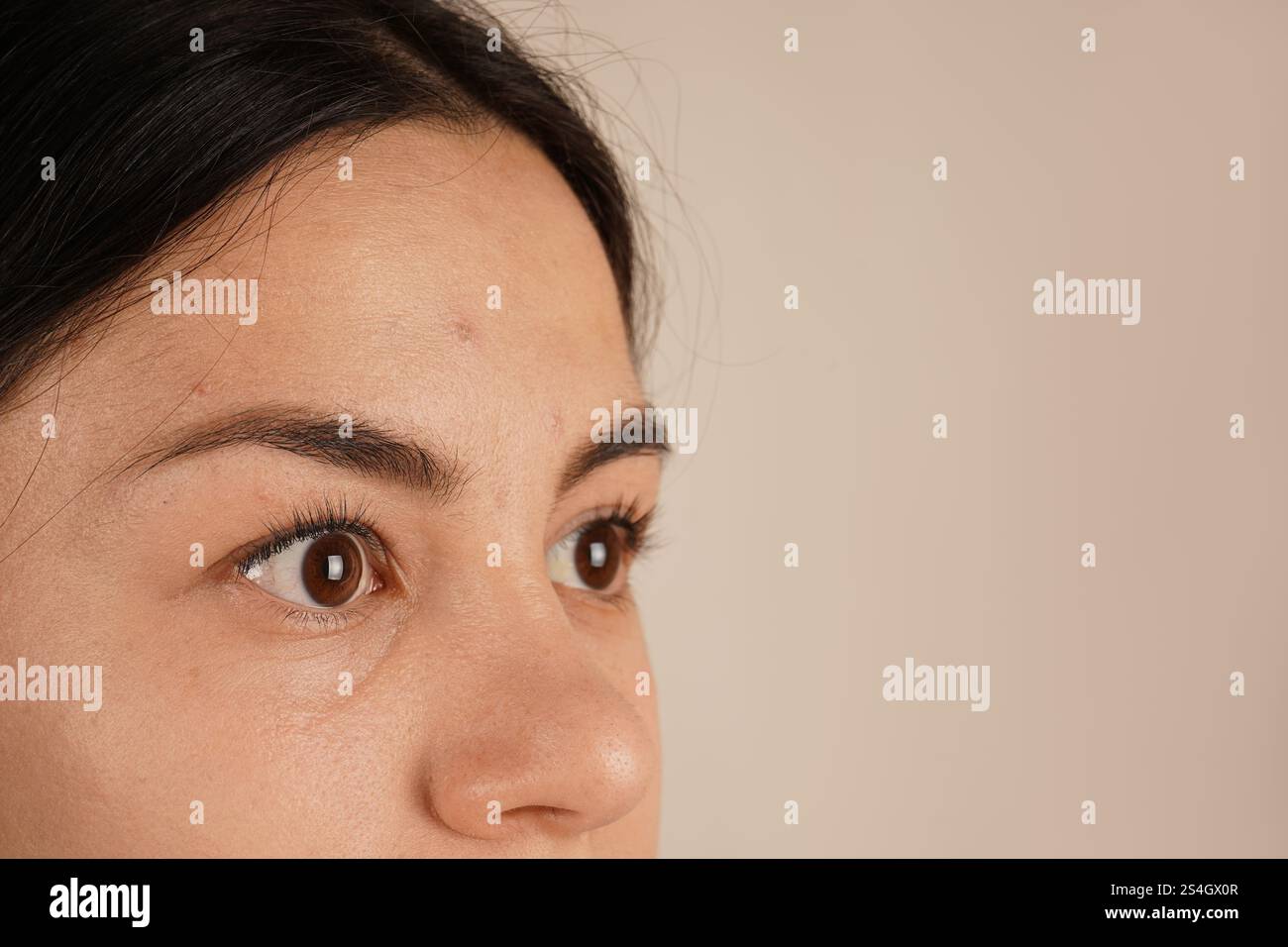 A close-up of a young woman's face. Her face radiates natural beauty ...
