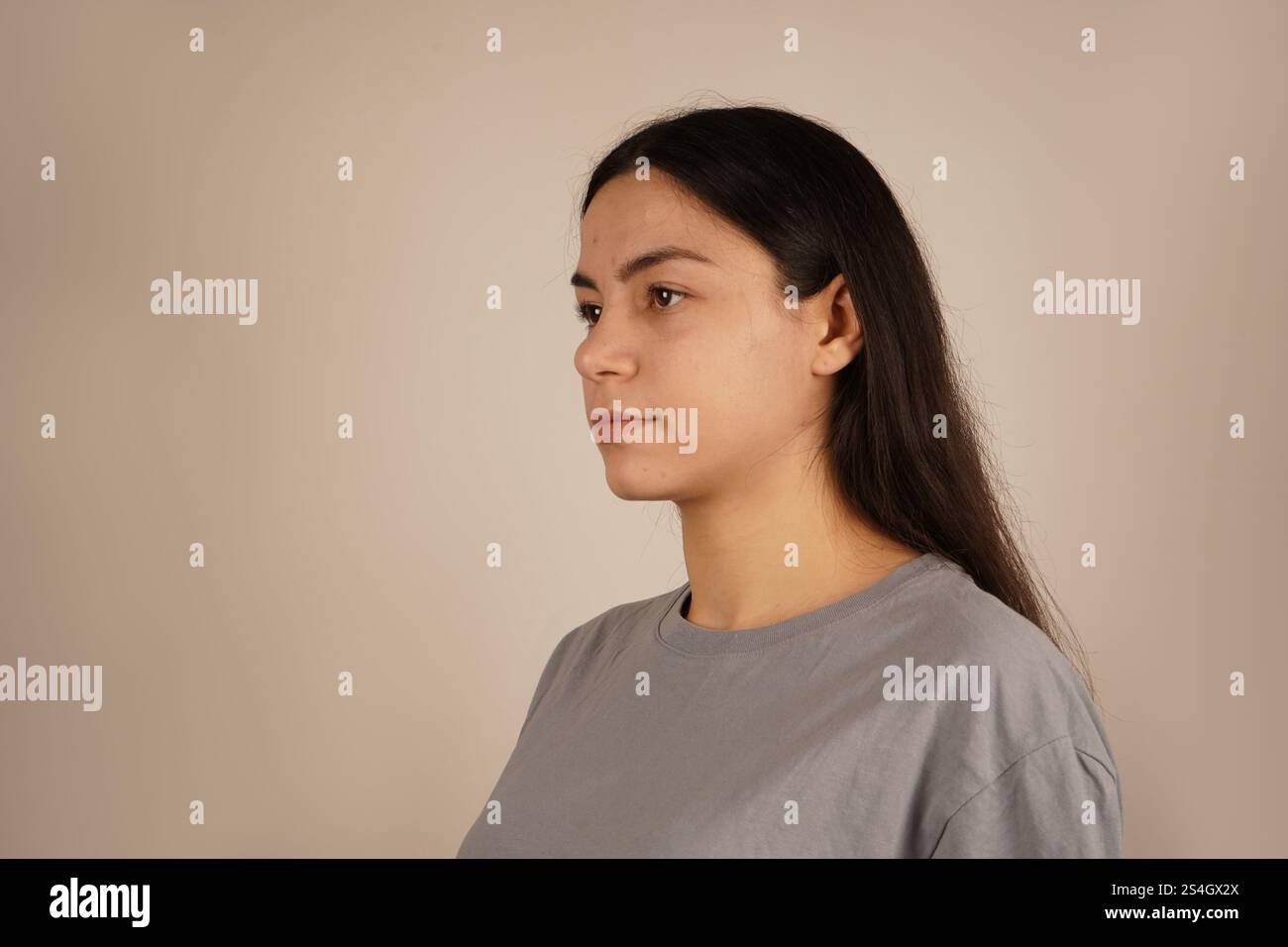 A moment of natural beauty and quiet confidence. The woman’s face is ...