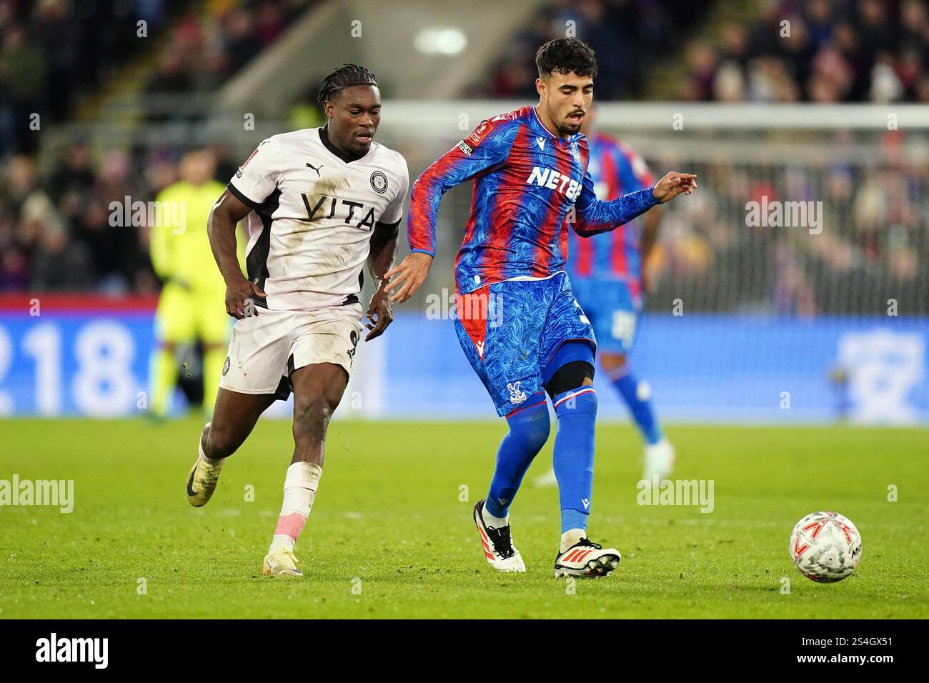 Stockport County's Isaac Olaofe (left) and Crystal Palace's Chadi Riad ...