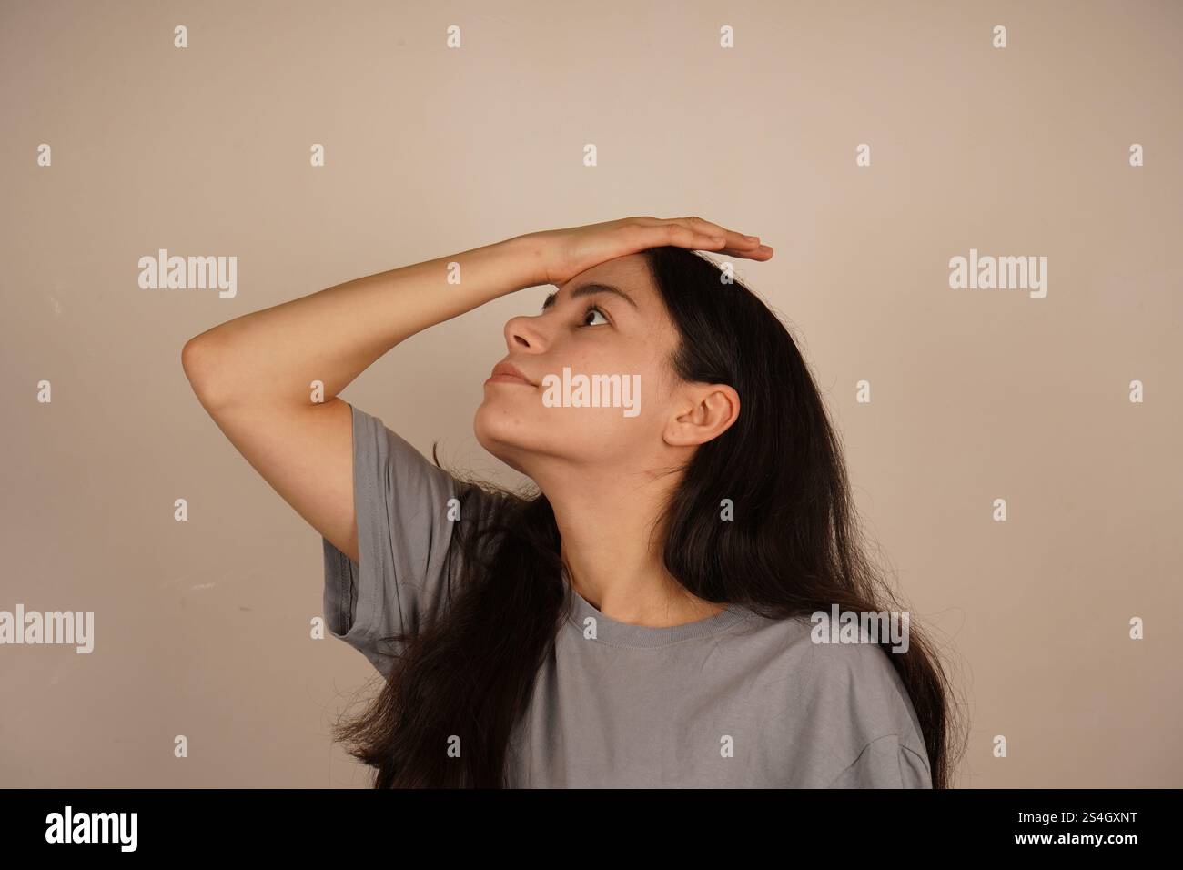 The photo captures a genuine moment of realization. The girl touches ...