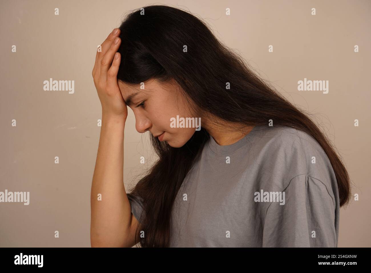 The photo captures a genuine moment of realization. The girl touches ...