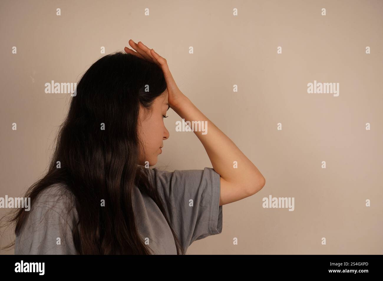 Her posture and expression reflect self-recognition. The photo captures ...