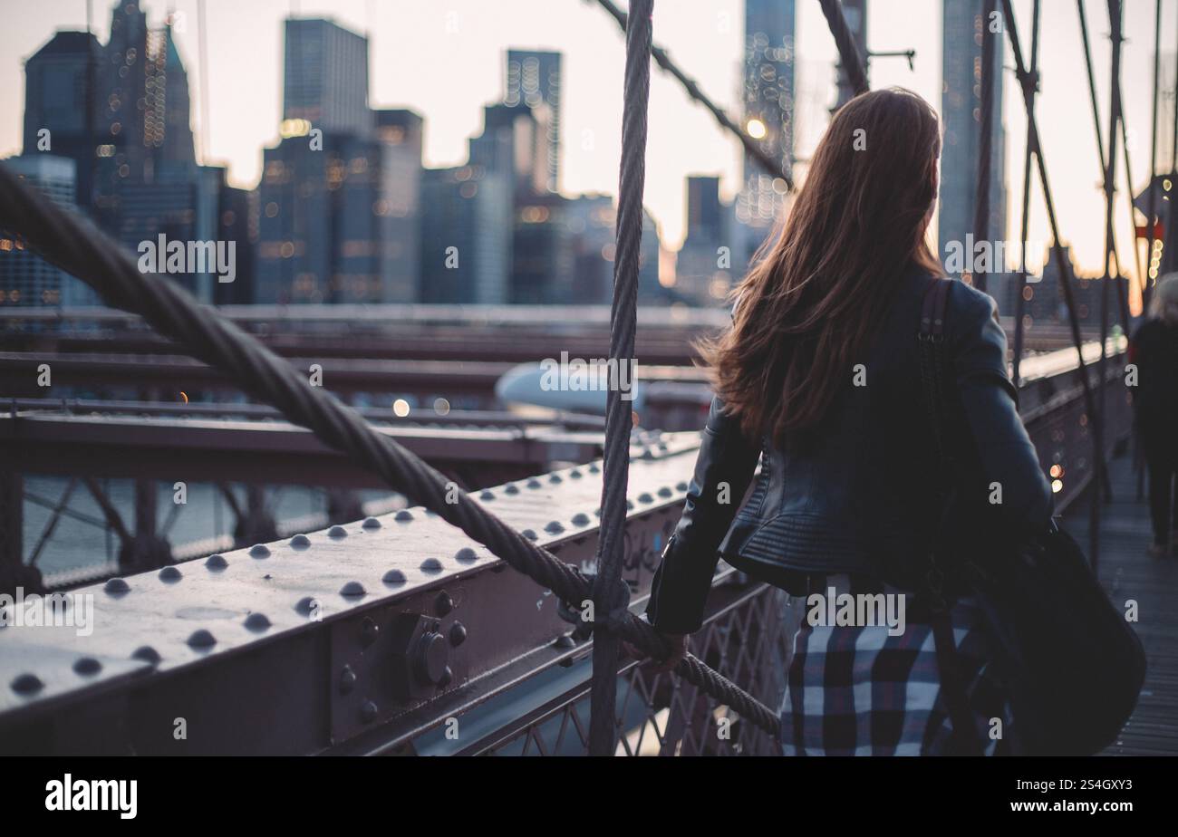 Sunset Stroll on the Brooklyn Bridge with New York Skyline Stock Photo - Alamy