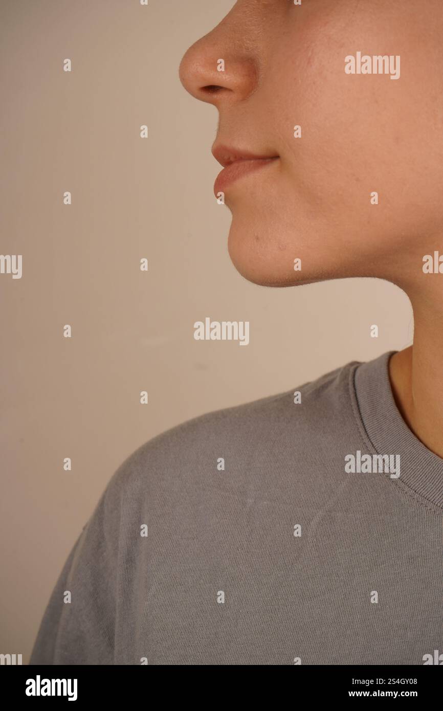 Part of a woman's face. Close-up shot of a young girl's chin. Detailed ...