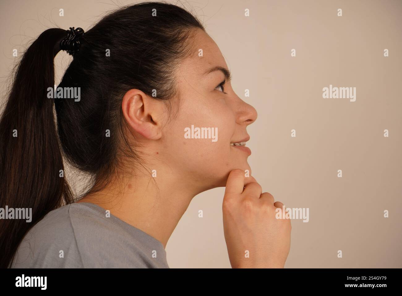 This pose depicts contemplation and inner concentration. With her chin ...
