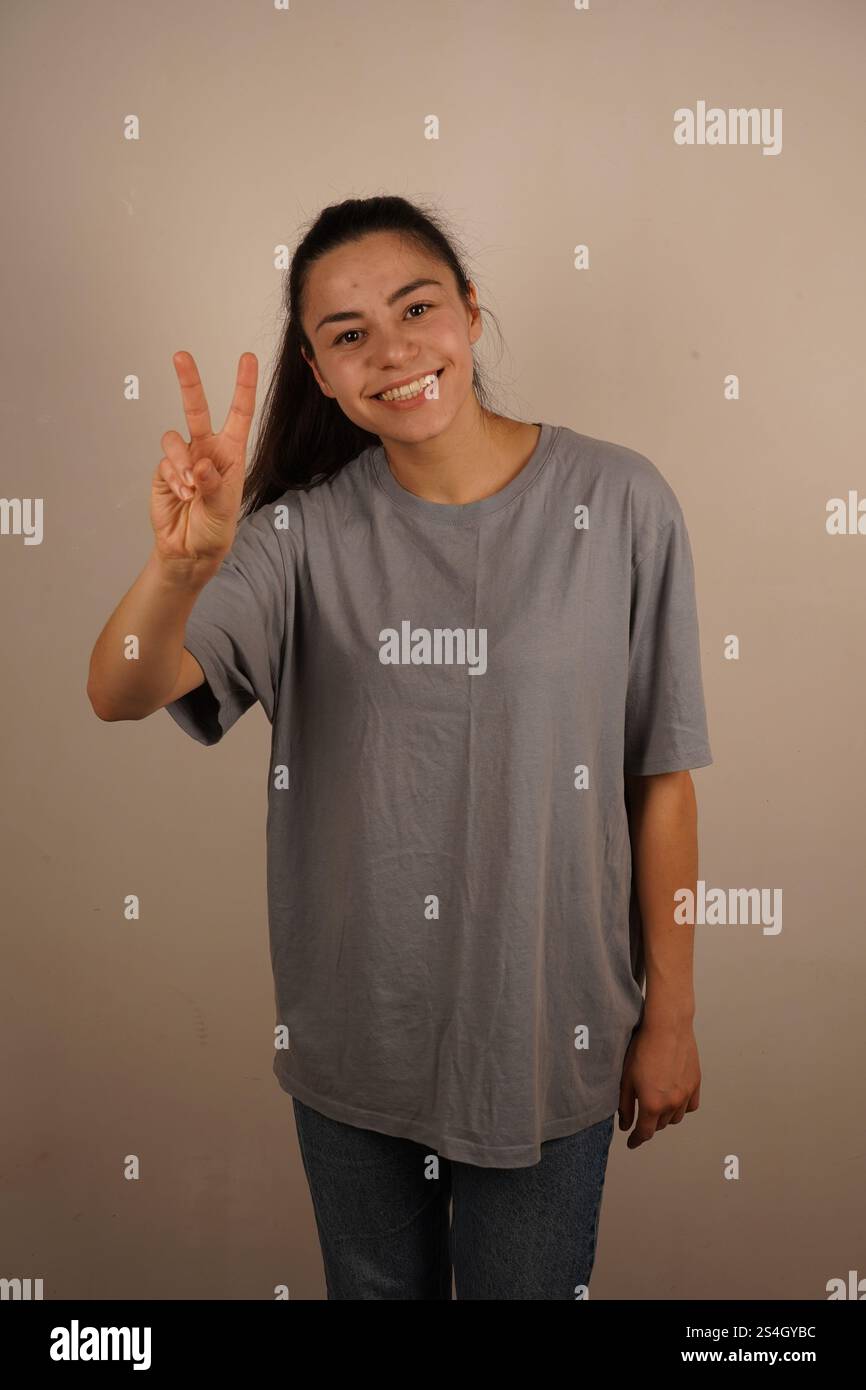 The fingers forming the peace sign represent harmony and unity. This ...