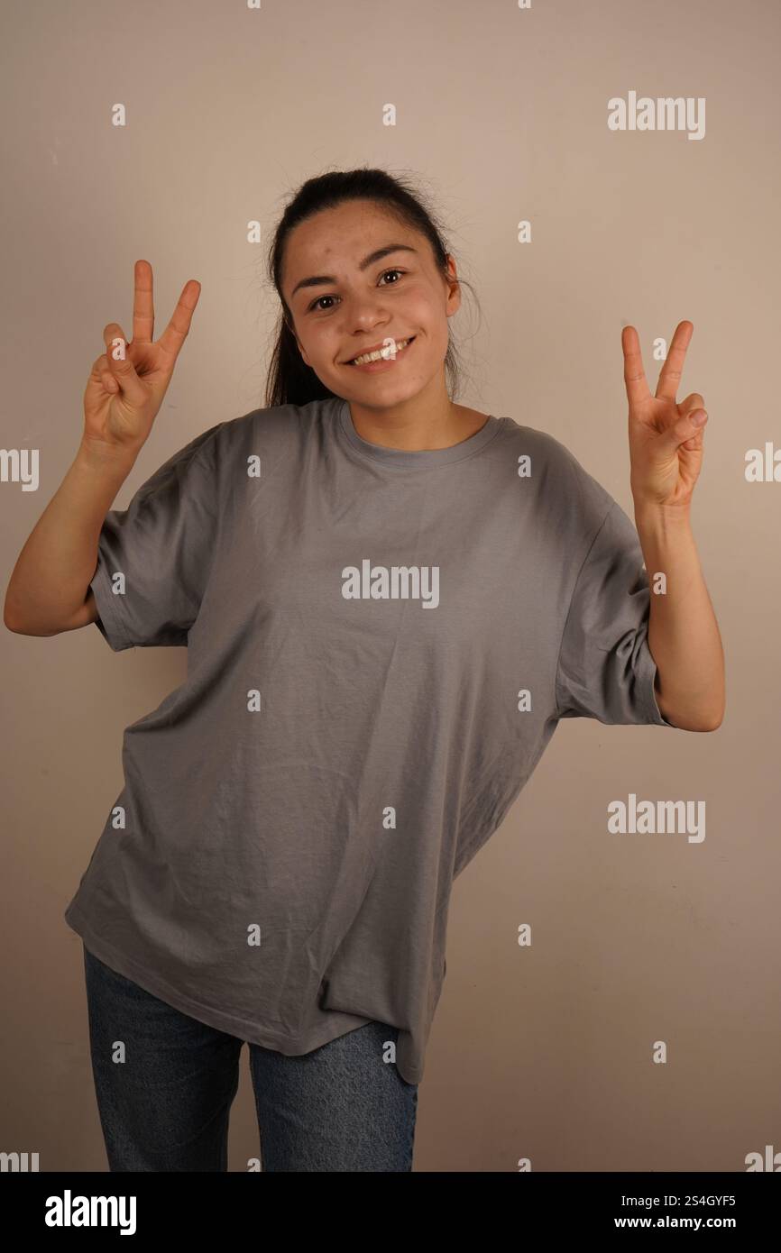 The fingers forming the peace sign represent harmony and unity. This ...