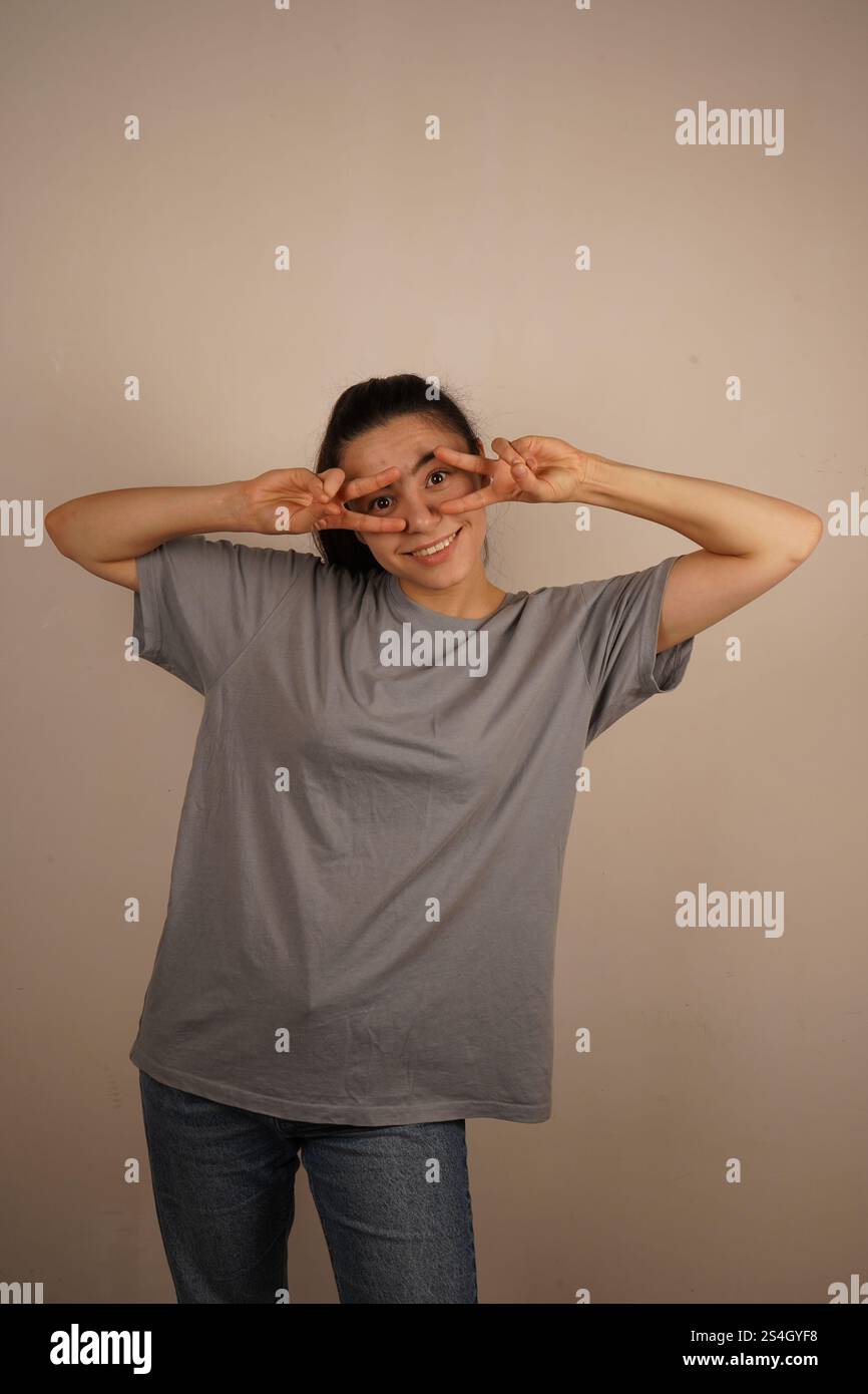 Stretching with raised arms, the gesture reflects a sense of relaxation ...