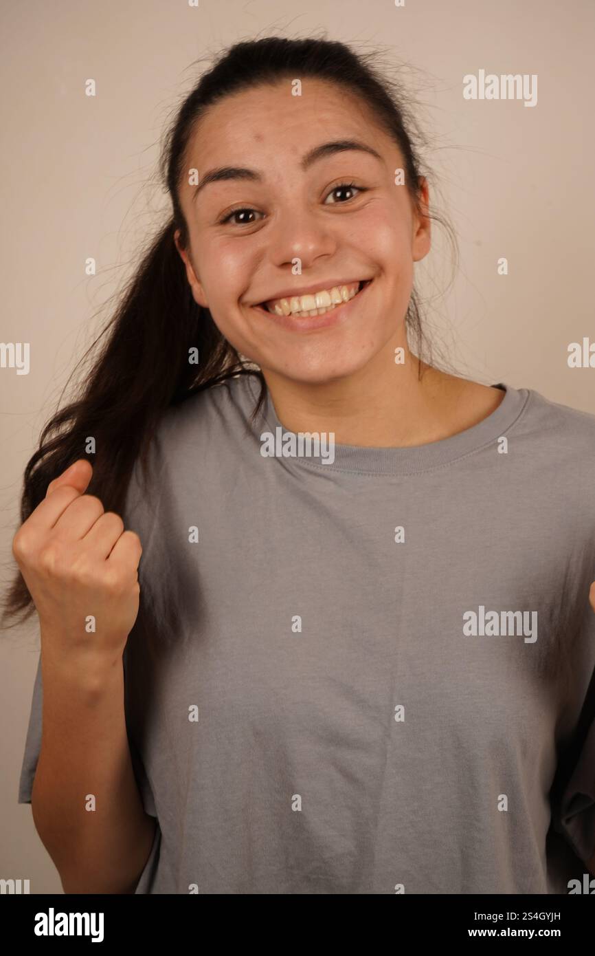 Clenched fists convey determination and readiness for self-defense. The ...