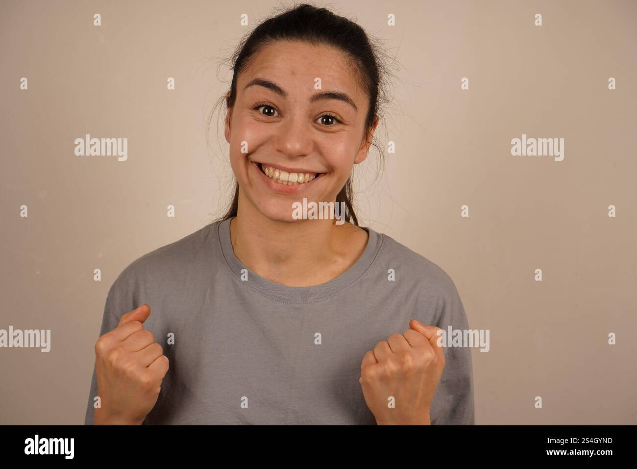 Clenched fists convey determination and readiness for self-defense. The ...