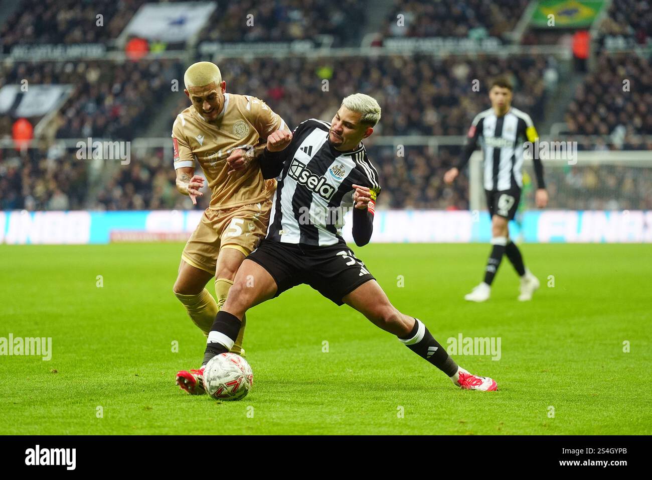 Newcastle United's Bruno Guimaraes (right) and Bromley's Danny Imray ...