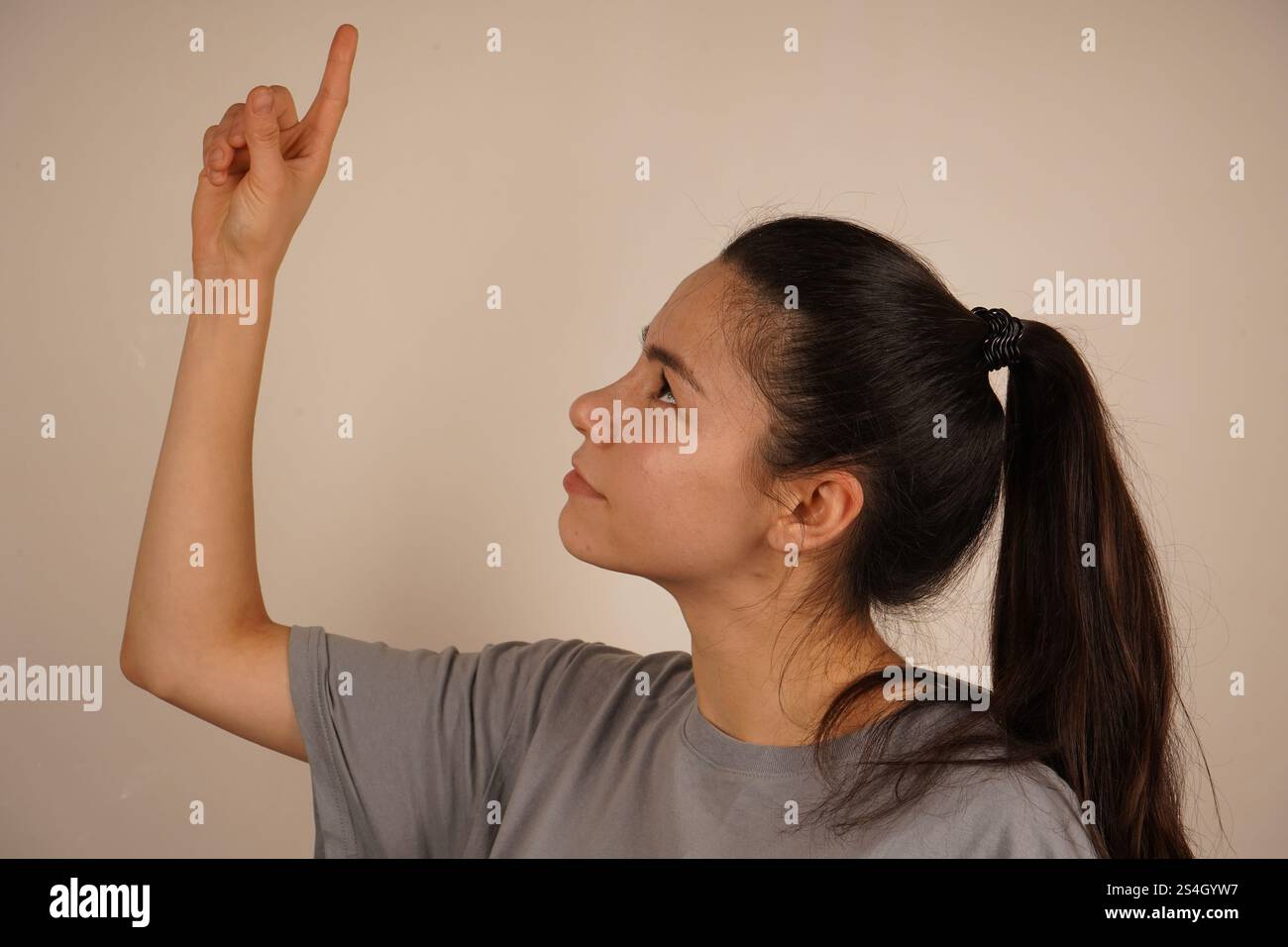 The lifted index finger highlights the emergence of an idea ...