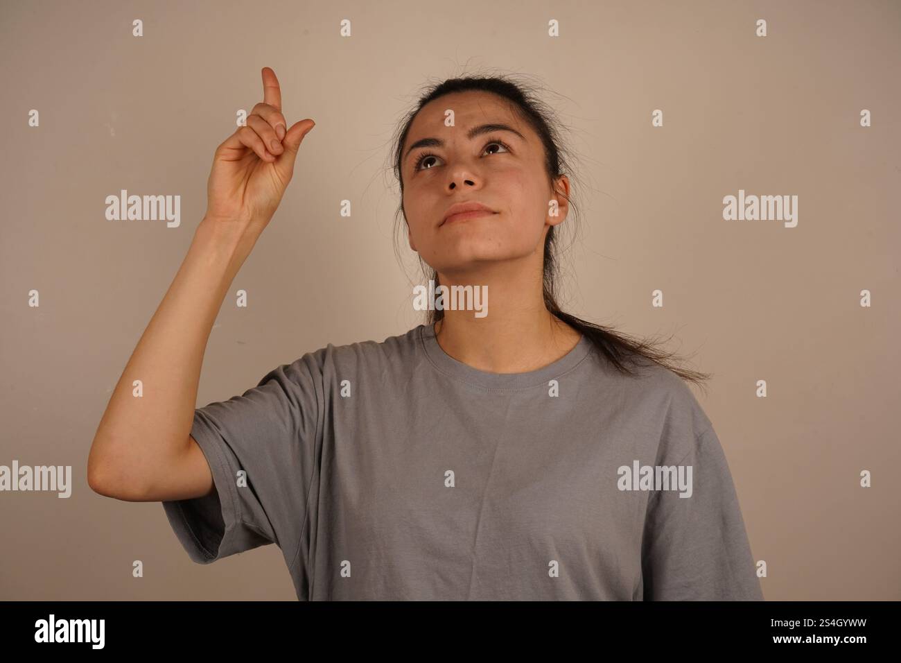 A raised index finger signals the birth of an idea, drawing attention ...