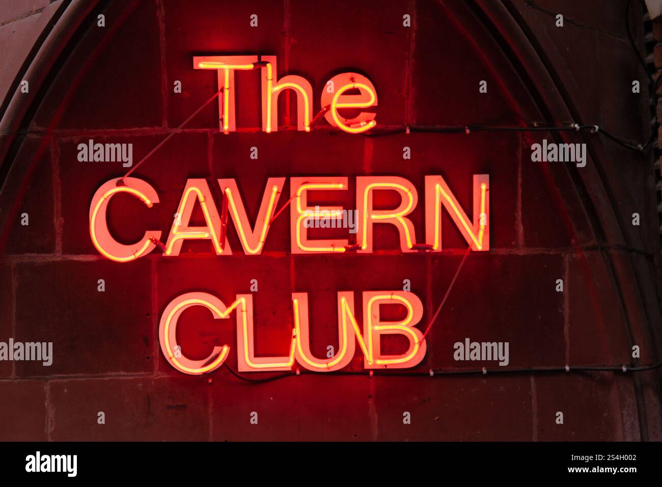 A Neon sign saying "The Cavern Club" hung over the entrance to the ...