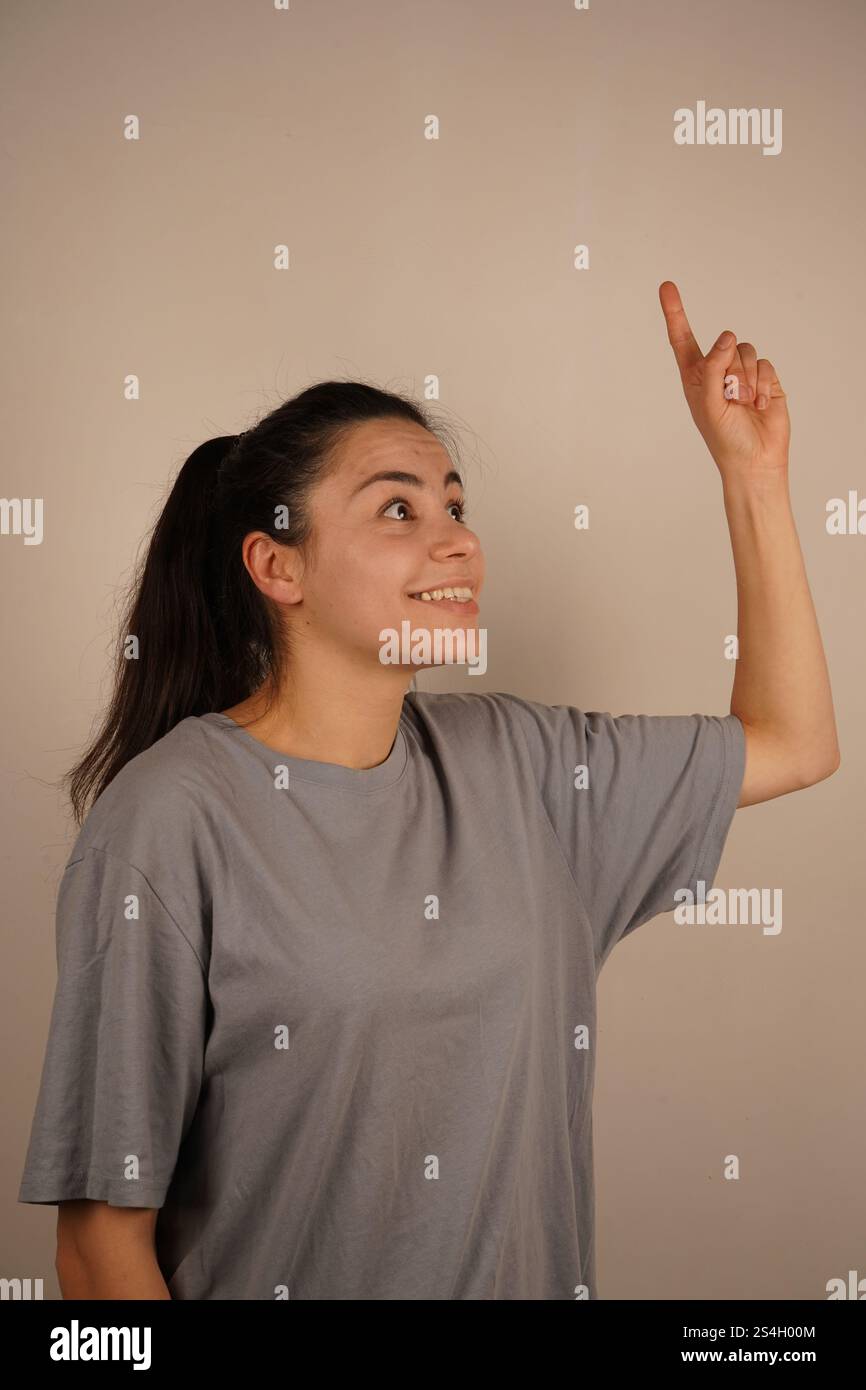 The lifted index finger highlights the emergence of an idea ...