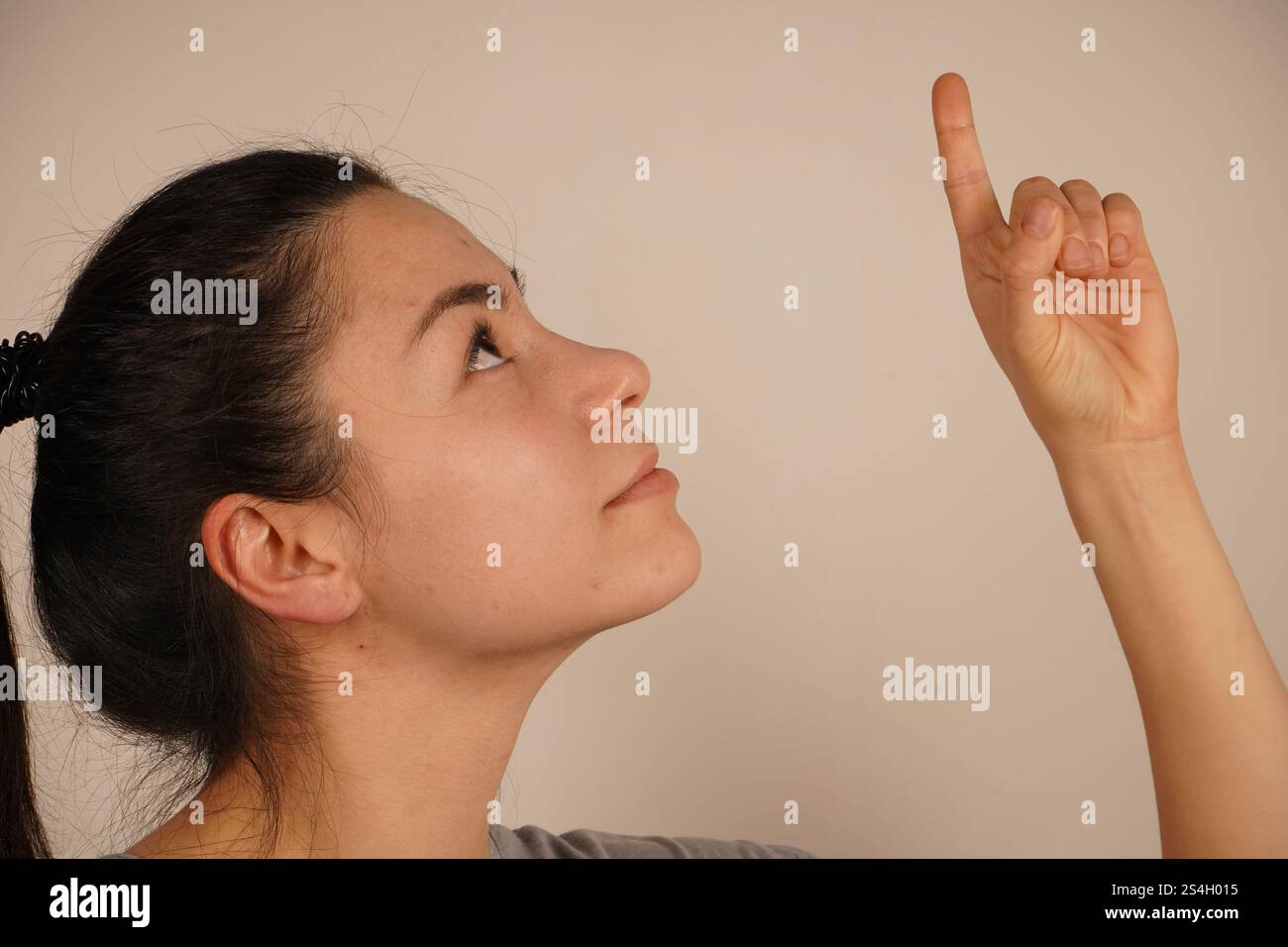 A raised index finger signals the birth of an idea, drawing attention ...