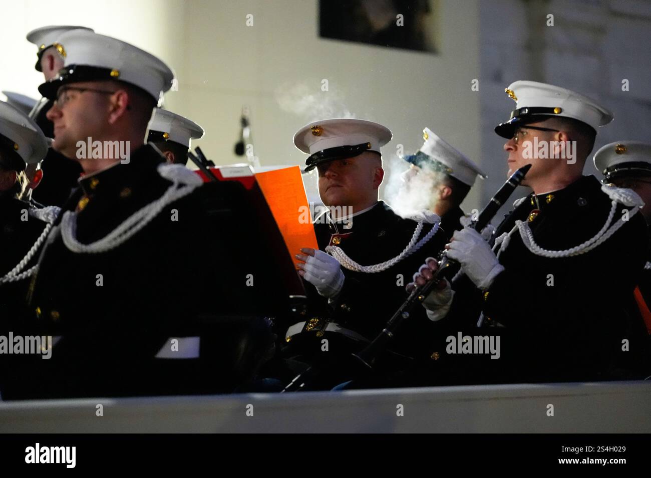 Members of "The President's Own" U.S. Marine Band take their seats ...