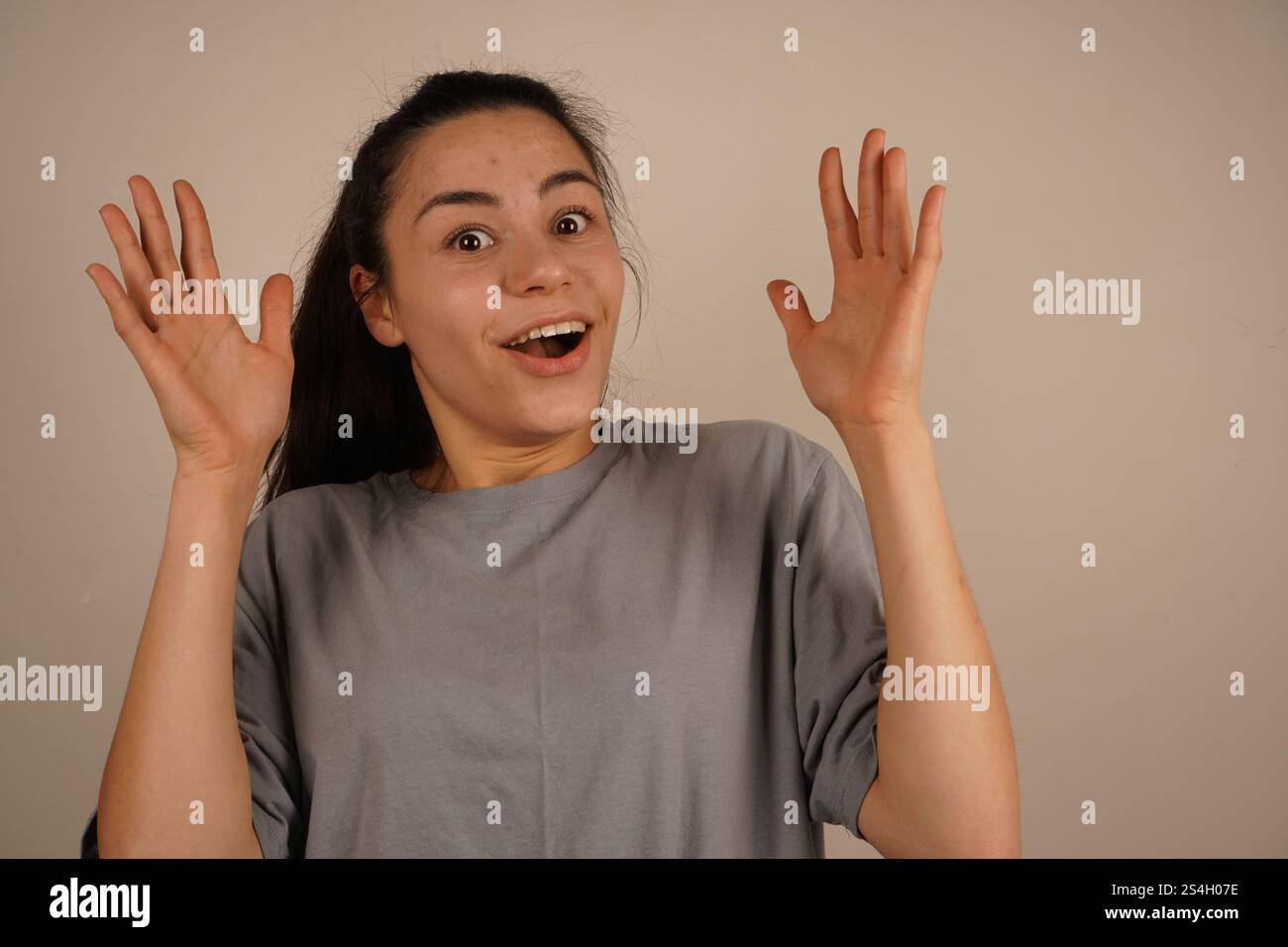 This gesture conveys an immediate reaction to something unexpected. The ...