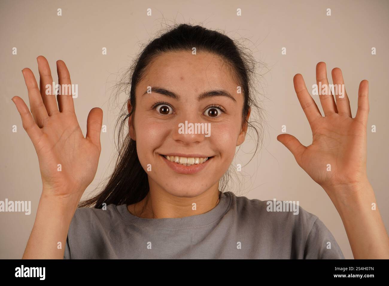 The open palms and raised posture enhance the feeling of surprise. The ...