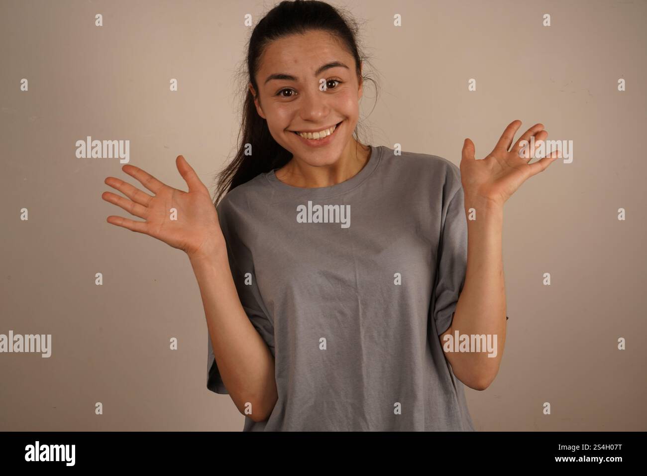 The arms are open, indicating a moment of shock. The body language ...