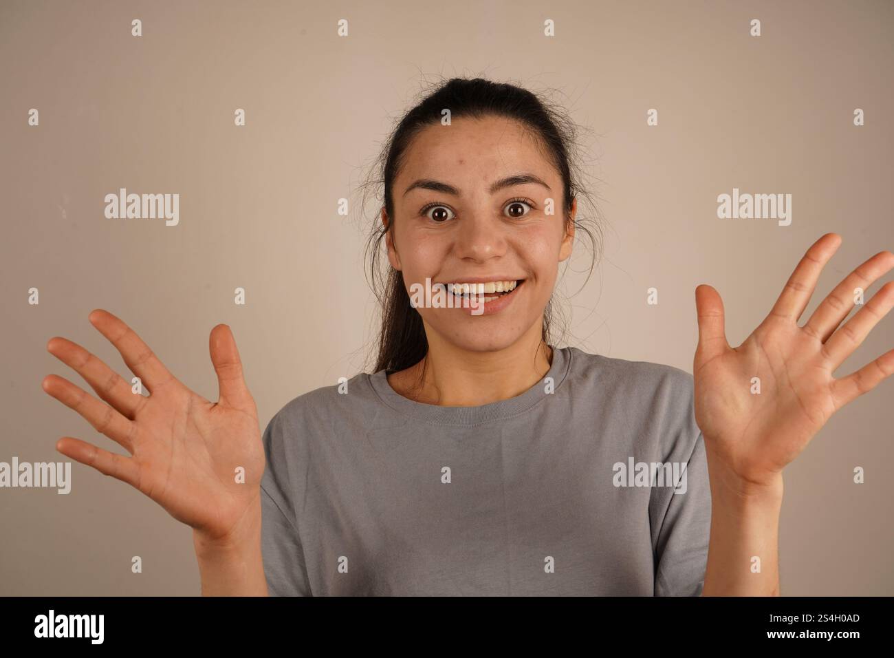 This gesture conveys an immediate reaction to something unexpected. The ...