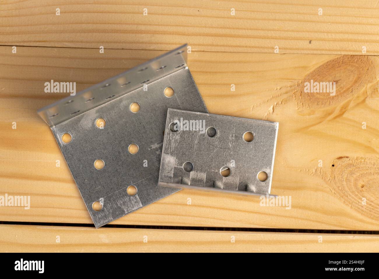 metal corner for connecting wooden parts with screws Stock Photo - Alamy