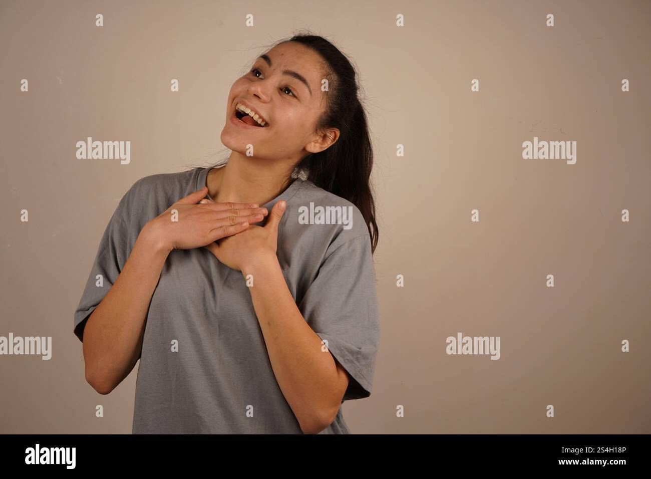 The expression captures a moment of sincere emotion and hope. The eyes ...