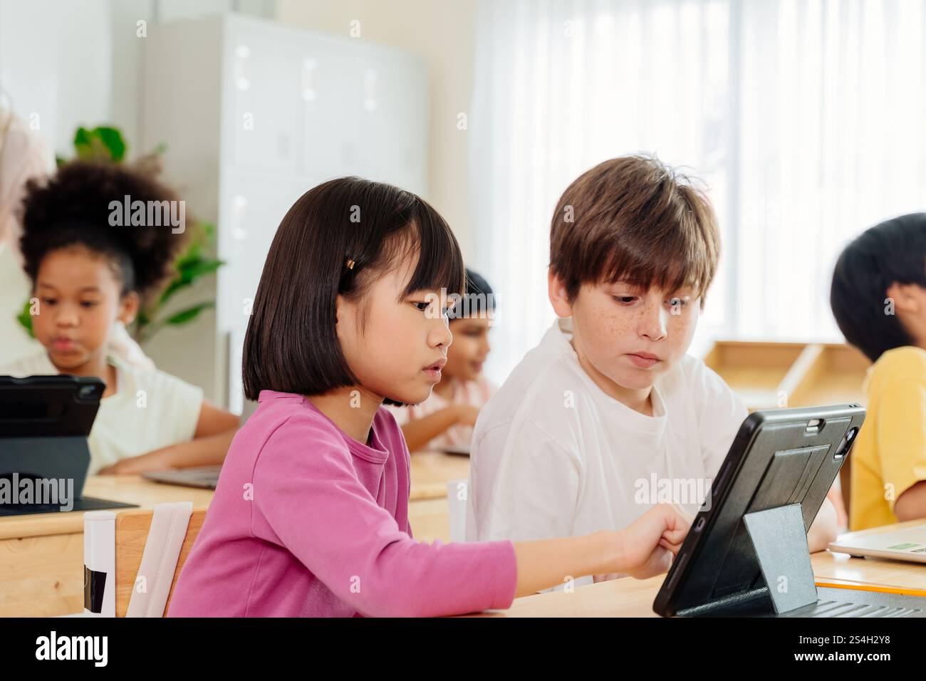 International Students Collaborate on Tablet: Diverse Elementary ...