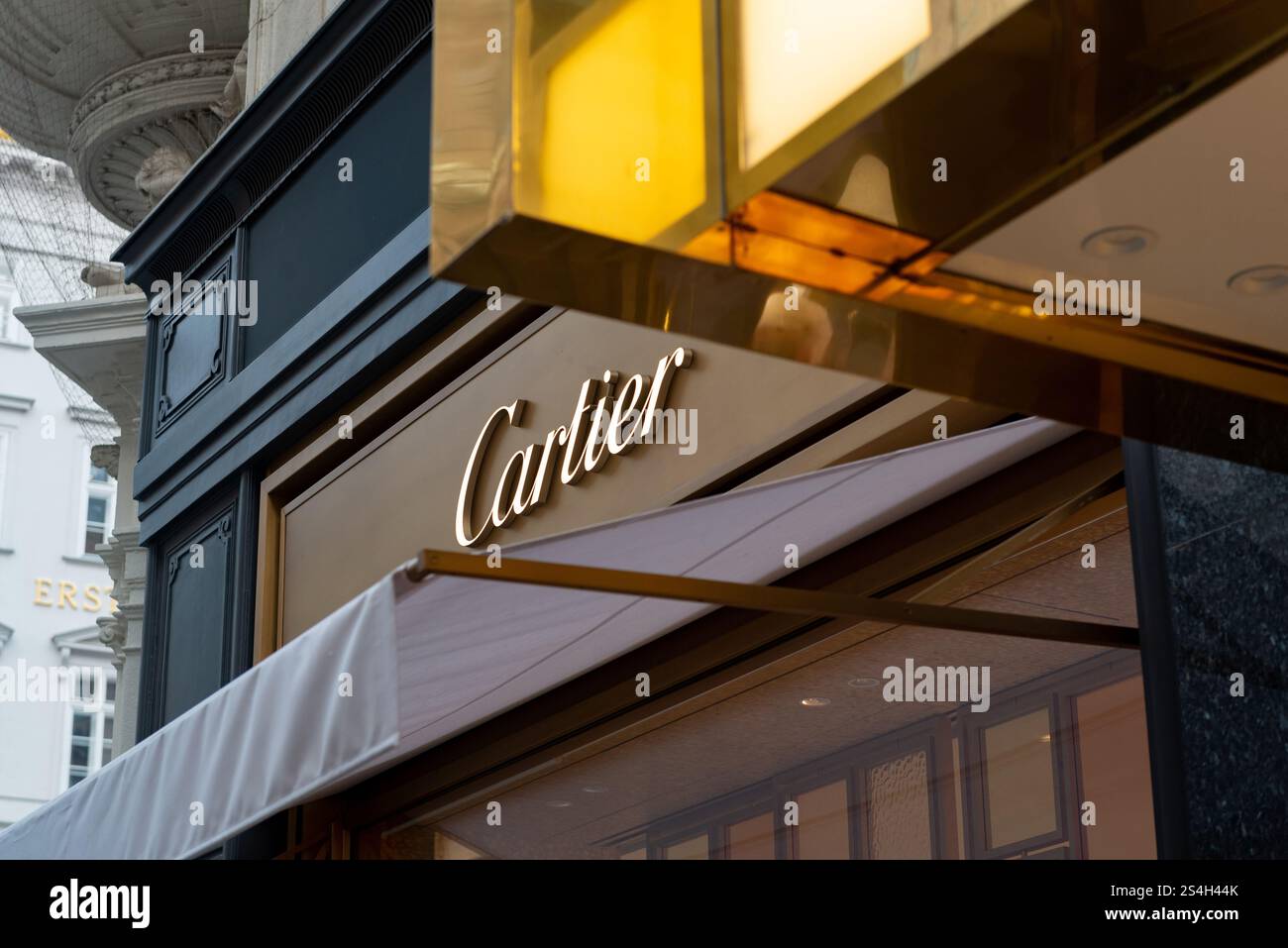 Cartier logo and brand sign displayed on a Vienna store front, in the ...