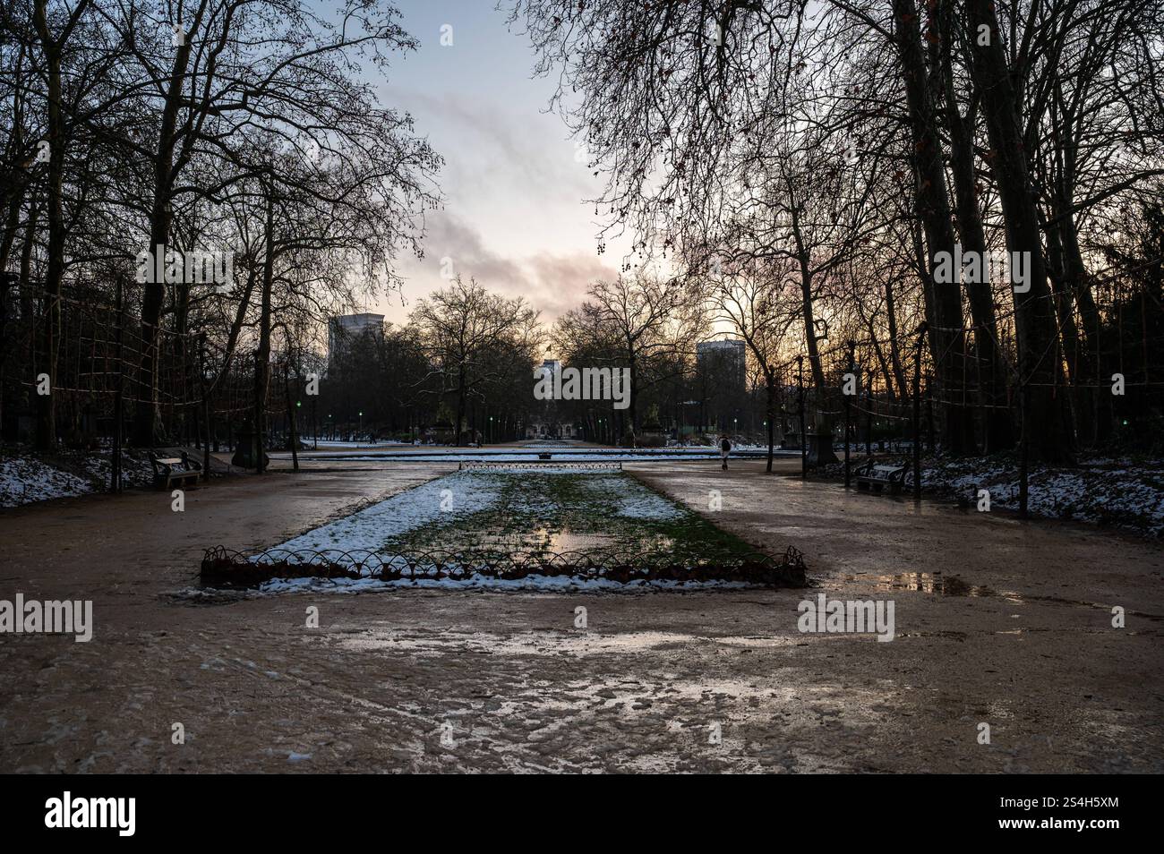 The Parc de Bruxelles or Warandepark covered with snow, side of the rue ...