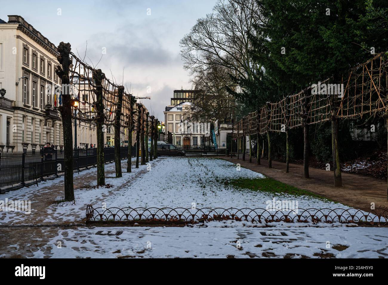 The Parc de Bruxelles or Warandepark covered with snow, side of the rue ...