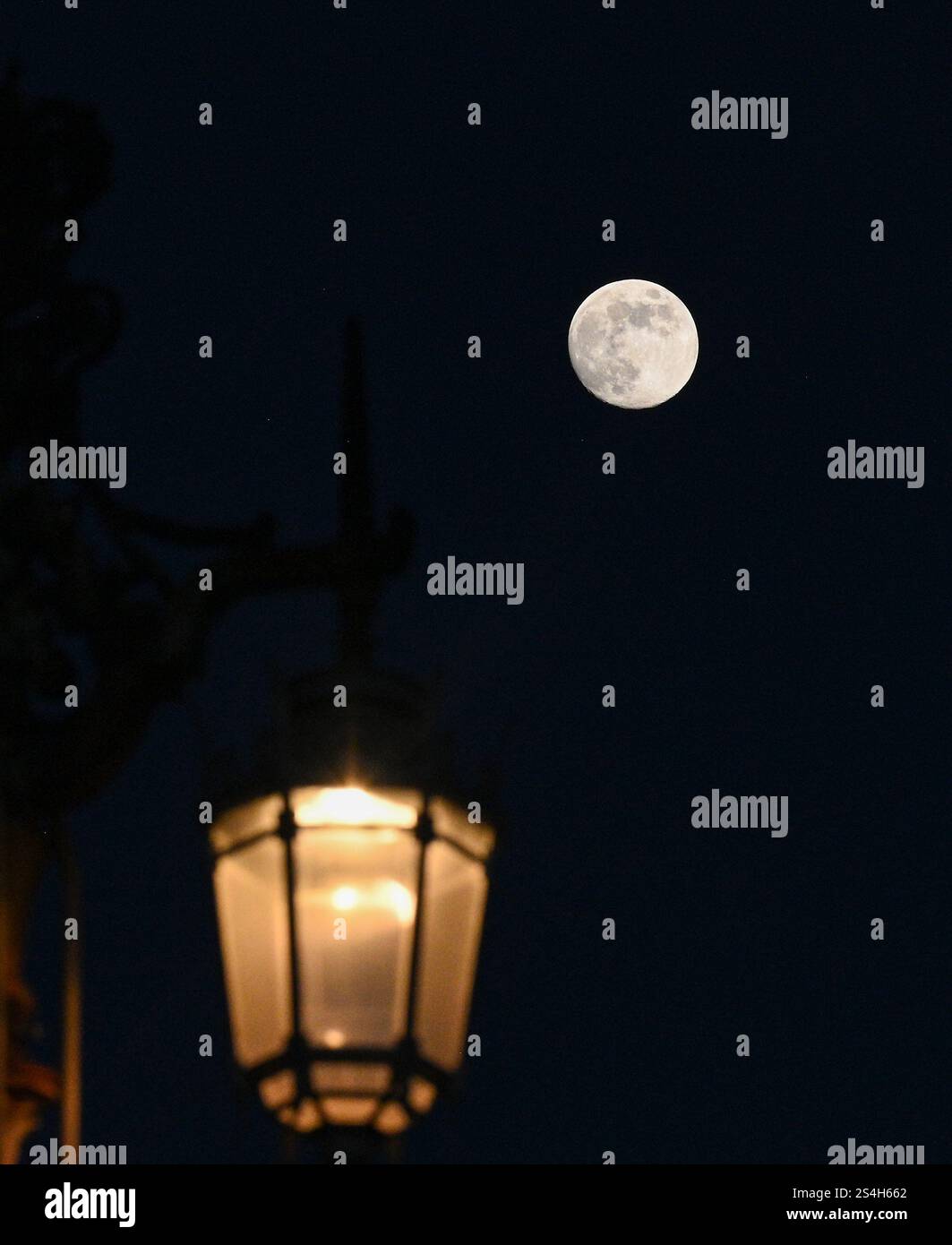 Brighton UK 12th January 2025 - A large moon rises behind a Brighton ...