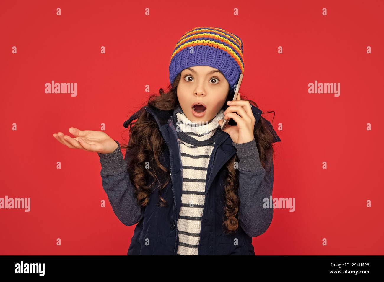 portrait of child greeting while phone conversation. communication ...