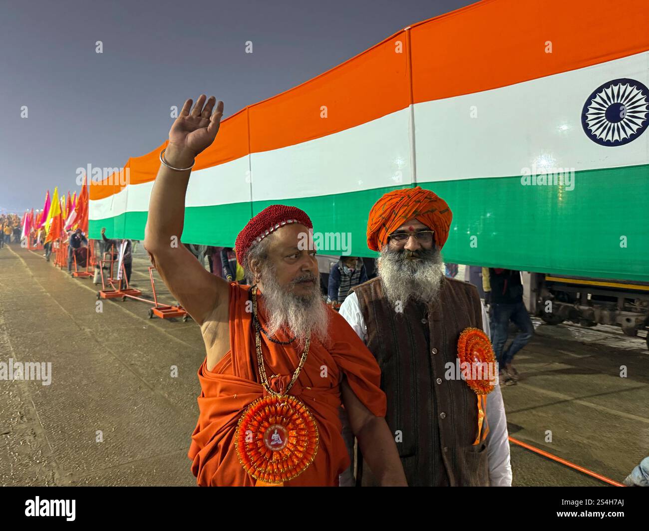 Indian Sadhus or Hindu holy men of Panchayati Bada Udasin Akhara wave ...