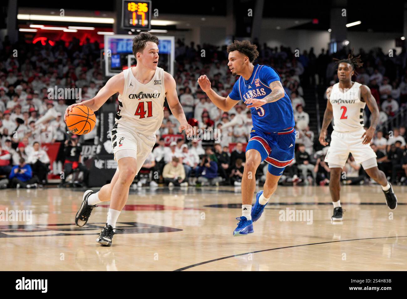 Cincinnati guard Simas Lukosius (41) dribbles against Kansas guard Zeke ...