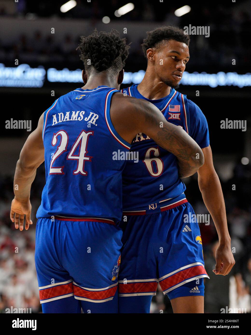 Kansas' KJ Adams Jr. (24) celebrates with Rylan Griffen (6) during an ...