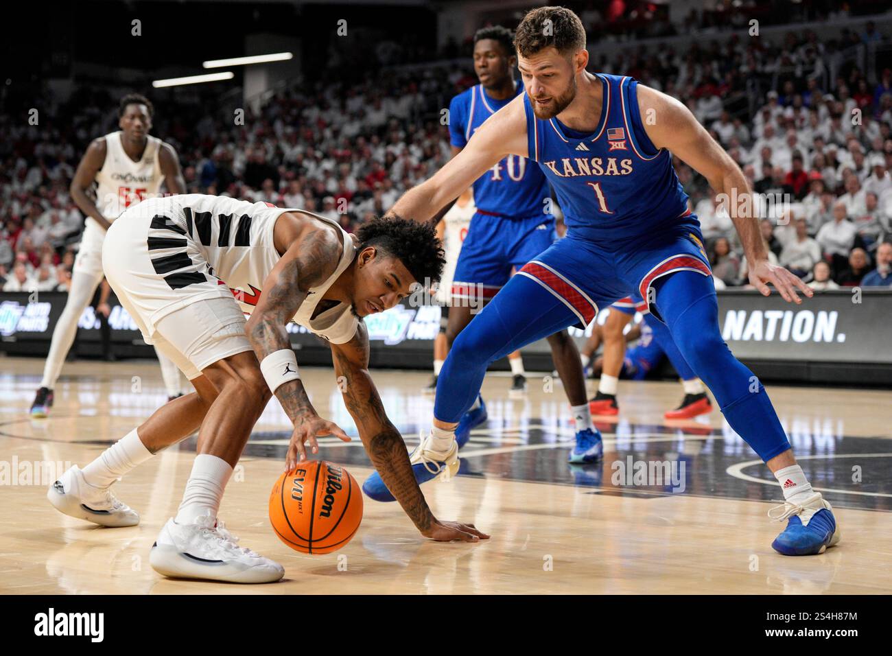 Cincinnati forward Dillon Mitchell (23) controls a loose ball against ...