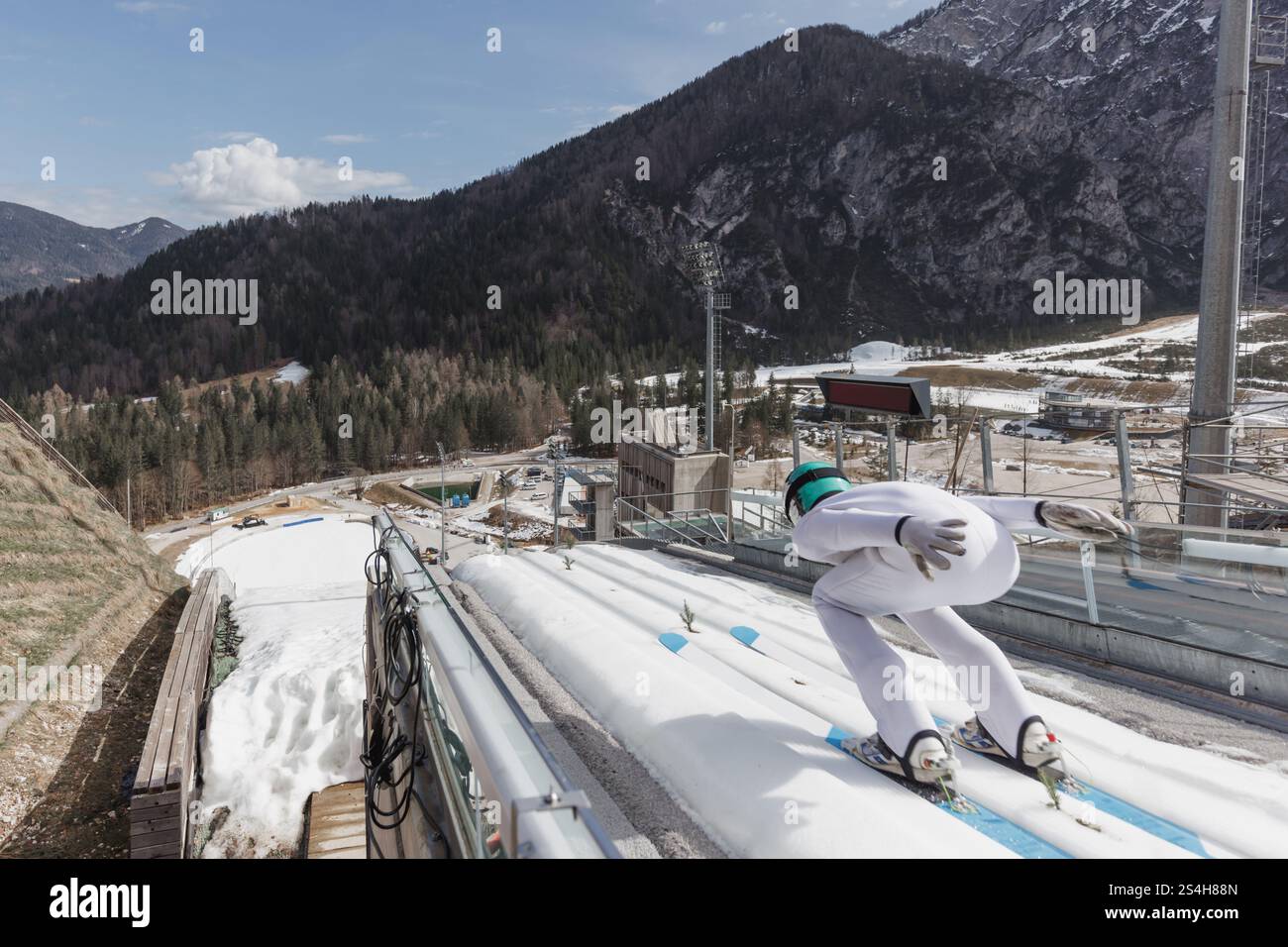 Jumper soaring through the air after takeoff from a ski jump. Extreme ...
