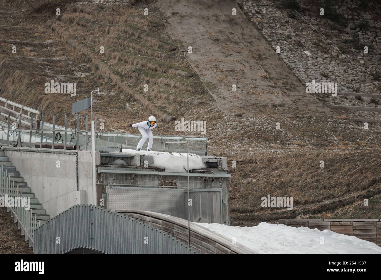 Jumper soaring through the air after takeoff from a ski jump. Extreme ...