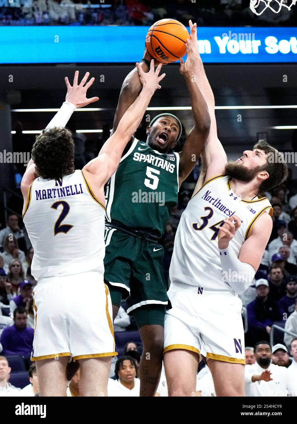 Michigan State guard Tre Holloman (5) looks to pass as Northwestern ...
