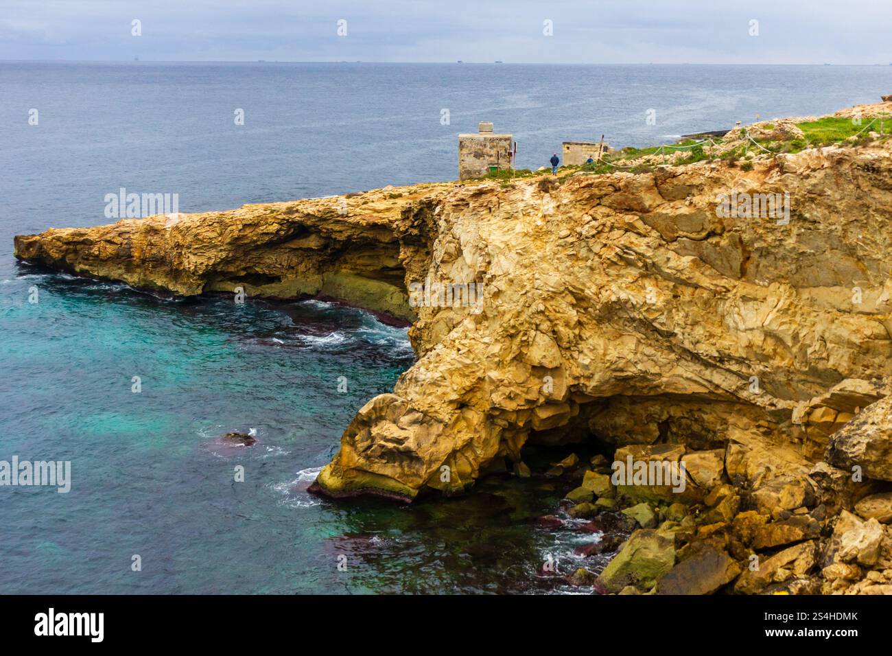 A beautiful coastal cliffside view showcases rocky terrain, lush ...