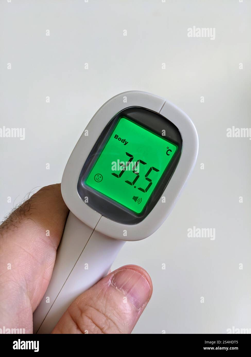 Person contactless thermometer checking hi-res stock photography and ...