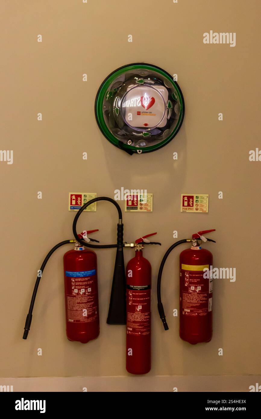 Essential Safety Equipment Wall Featuring Fire Extinguishers and AED ...