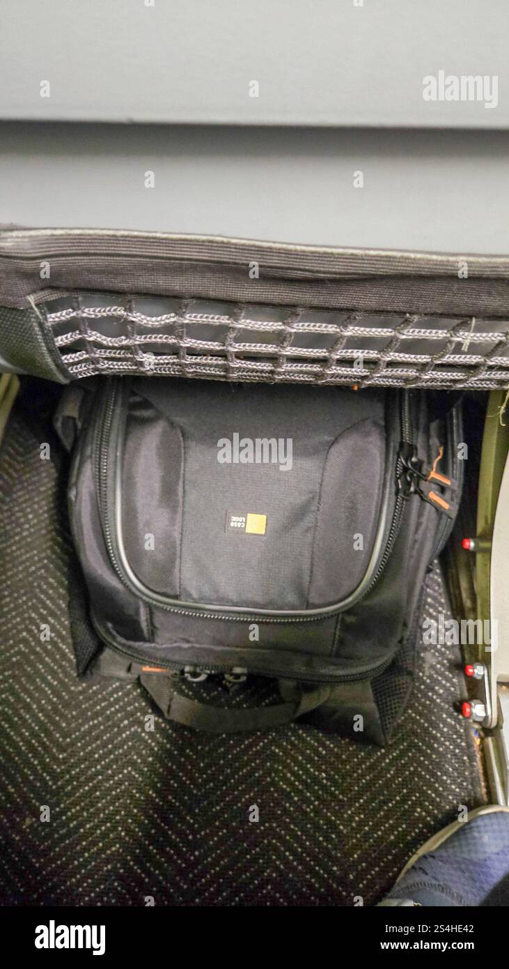 Bag under the seat of an airplane Stock Photo - Alamy