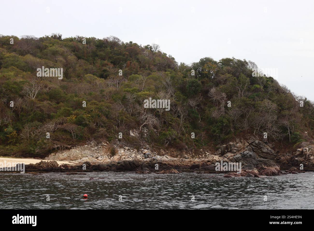 A mountain of La India beach part of the bay of Cacaluta, part of the ...
